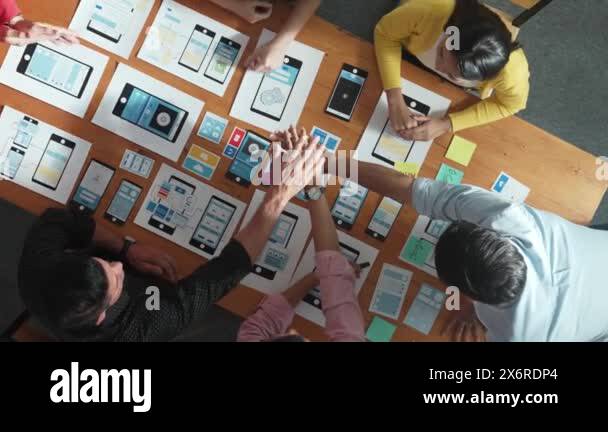 Creative team putting hand together while brainstorm about Ux Ui design ...