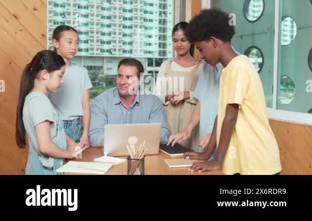 Skilled teacher clapping hand to encourage student to do project or ...