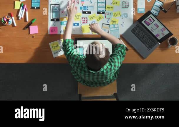 Top view of smart developer working on tablet and writing Ux Ui design ...