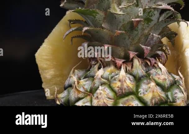 Close up video of fresh pineapple with slice of peel pineapple insert ...