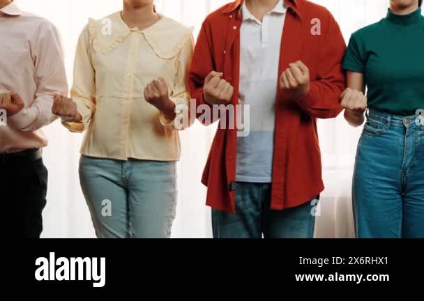 Startup company employee team together raising fist symbolize ...