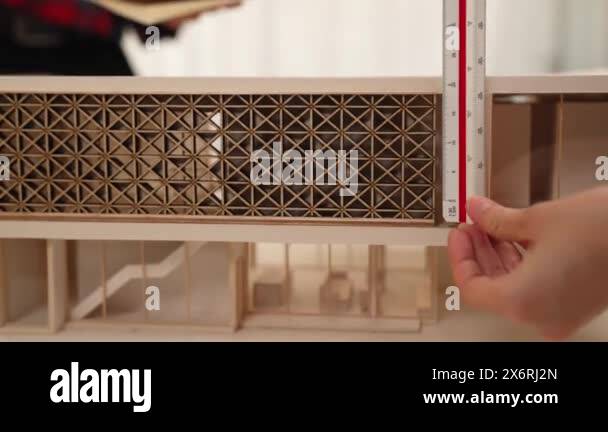 Home designer using architectural equipment review and measure ...