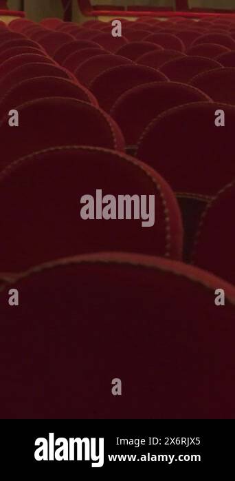 Empty classic theater. Rows of empty red velvet seats inside a theater or opera. Empty ...