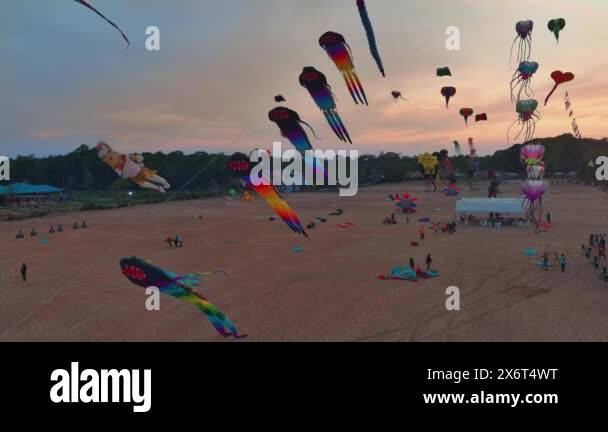 Soar high above a vibrant and colorful kite festival in this ...