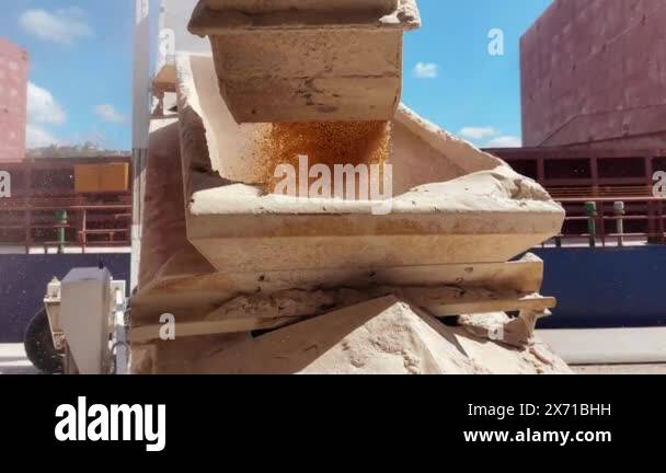 Close up grain elevator in port. Grain wheat loading to bulker ship ...