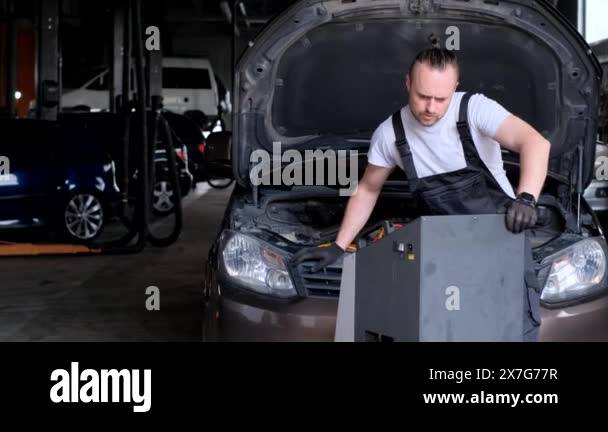 Fixing up cars Stock Videos & Footage - HD and 4K Video Clips - Alamy