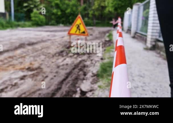 Some signs signage for work in progress on urban street. Barriers and ...