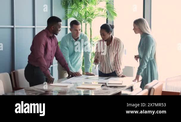 Group meeting of millennial diverse teammates review infographics data ...