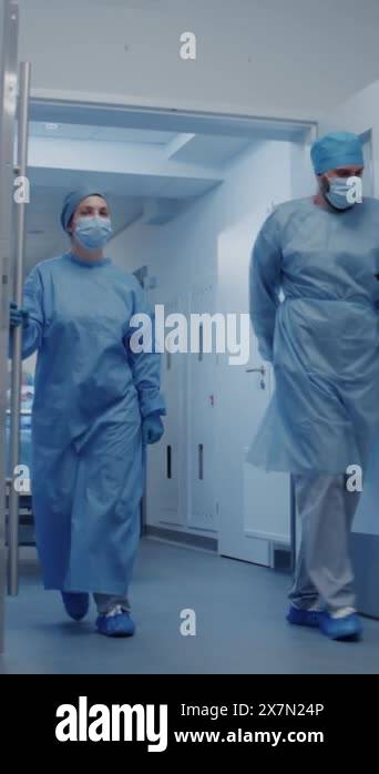 Nurse and paramedic open medical facility corridor doors. Multi ethnic ...
