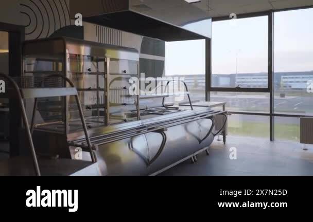 Glass display of cafe near panoramic window in future shopping mall ...