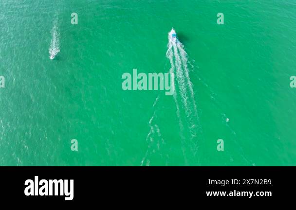 Small motorboat sailing fast on ocean waves with ripple water surface ...