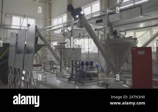 Funnel filters with pipes at wastewater treatment plant. Dirty water processing technology in ...