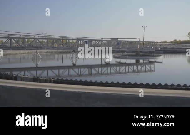 Aeration pool filled with water to brim with sky reflection on surface ...