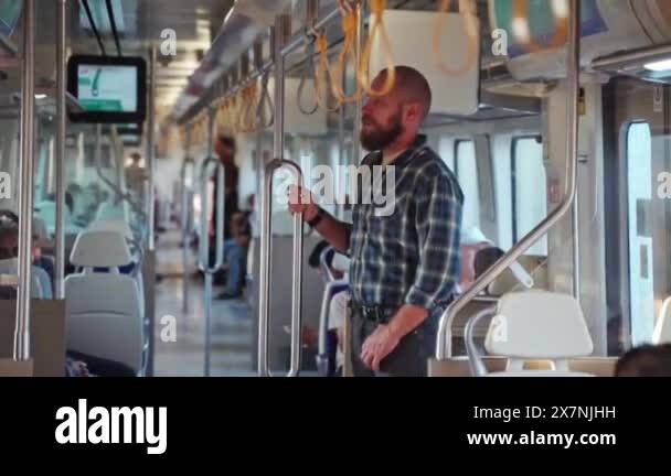 Adult with a backpack using metro train car. An adult heading to work ...