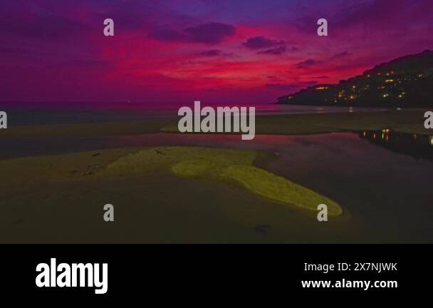 Time lapse colorful sunset reflection in the beach puddle. The colors ...