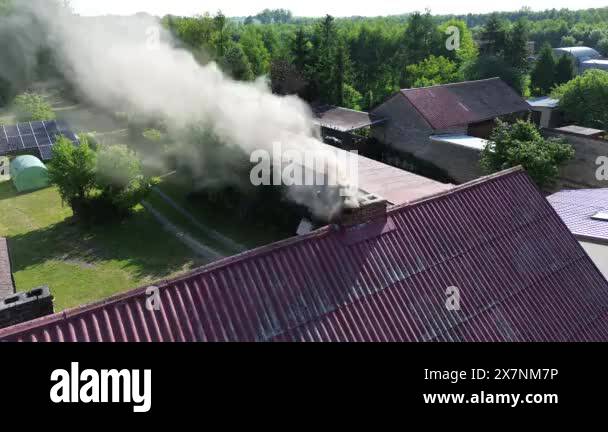 Air pollution from chimney Old house heating with solid fuel Thick ...
