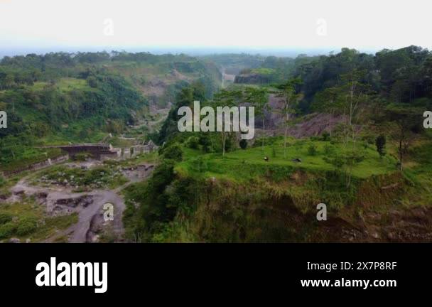 4k aerial footage of the Mount Merapi area, consisting of ravines that ...