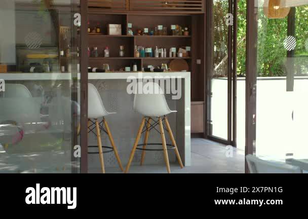 Modern cafe interior with clean design aesthetics, showcasing two white ...