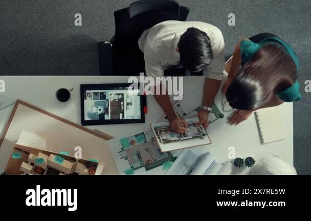 Top down view of skilled business man and colleague design house ...