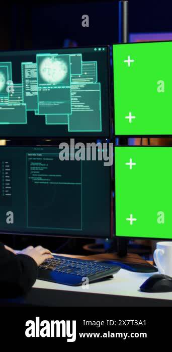 Vertical video Cybercriminal using isolated screen PC in apartment hideout getting hacking ...