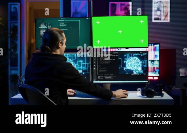 Hacker Using Green Screen Monitor And Artificial Intelligence To Write Spyware Software