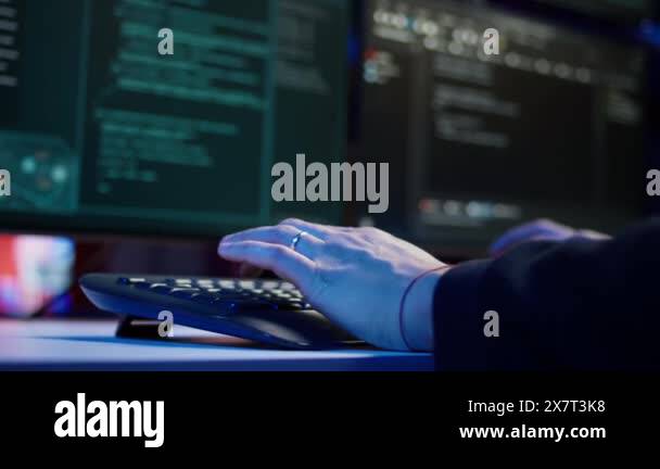 Cybercriminal illegally breaching security systems while hiding in secret HQ, close up shot ...