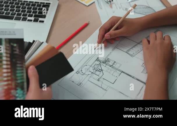 Slow motion interior designer using architectural equipment draw a ...