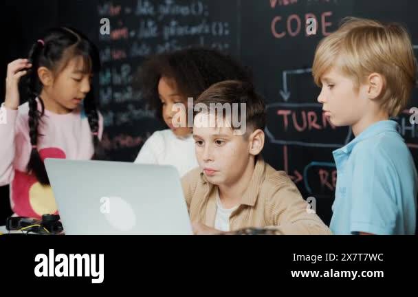 Closeup of boy using laptop programing engineering code and writing ...