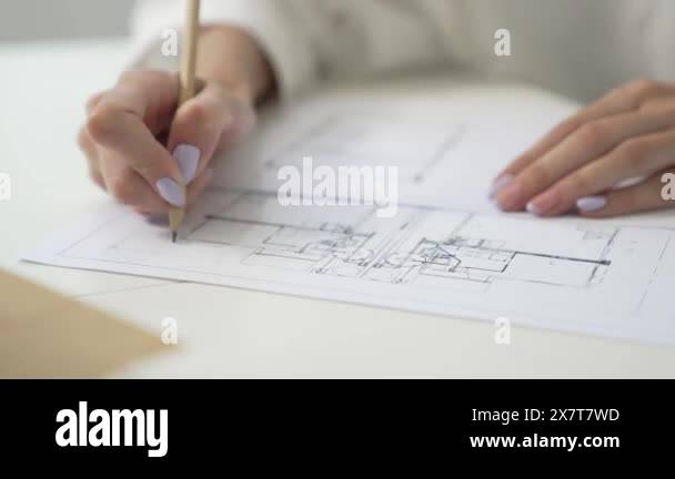 Closeup of professional young beautiful architect hand drawing ...