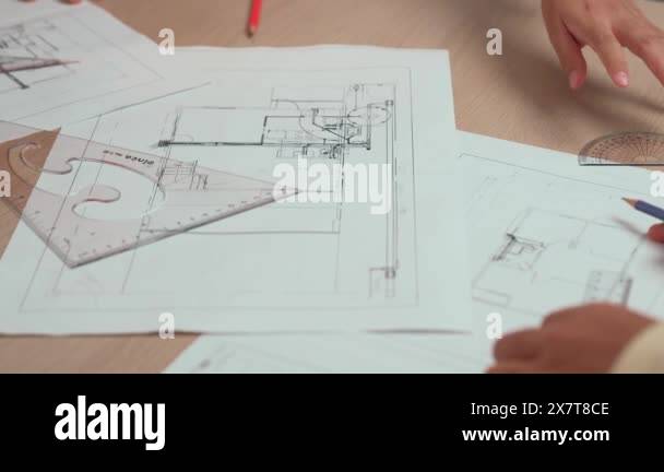 Slow motion interior designer drafting blueprint with customer ...