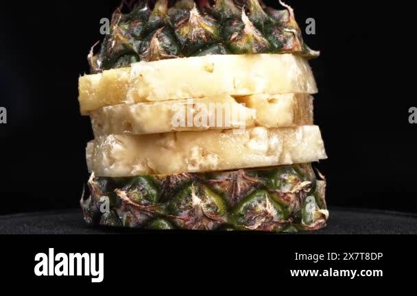 Close up video of fresh pineapple with slice of peel pineapple insert ...
