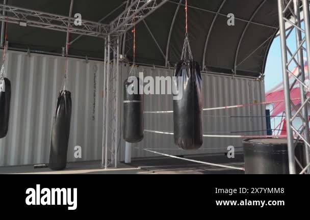 Open air gym for combat and boxing with hanging punching sacks without ...