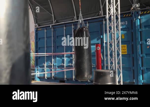 Open air gym for combat and boxing with hanging punching sacks without ...