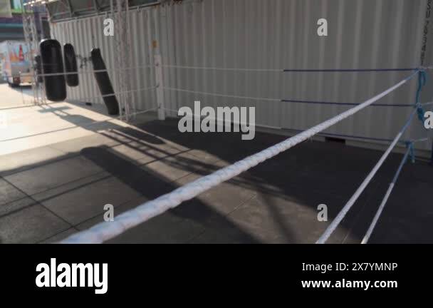 Open air gym for combat and boxing with hanging punching sacks without ...