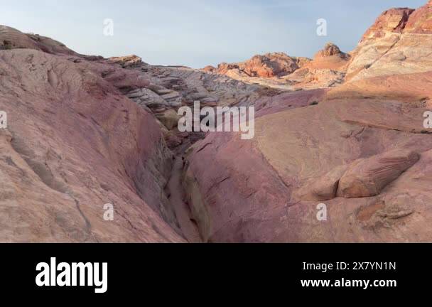 Looking down into the pastel pink narrow walls of Pink Canyon slot with ...