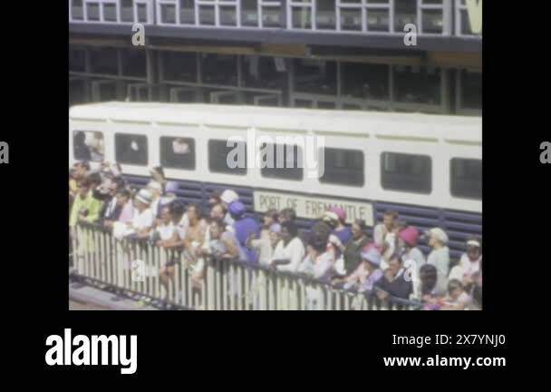 Melbourne, Australia may 1969: Vintage footage of a crowd waiting at a ...
