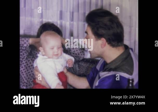 Berlin, Germany may 1967: Vintage footage of a father holding and ...