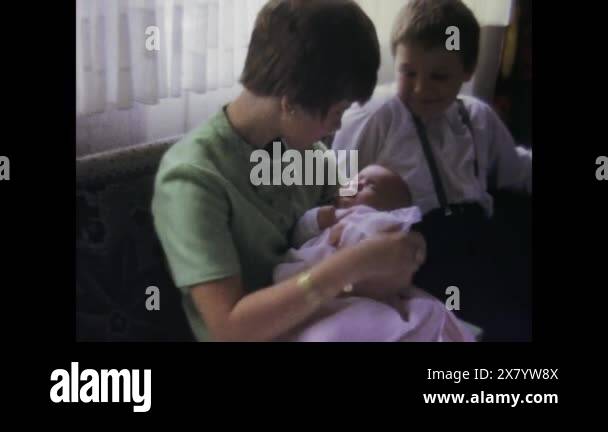 Berlin, Germany may 1967: Vintage footage of a mother bottle-feeding ...