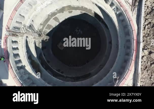 deep subway, a construction machine is excavating inside the mine shaft ...