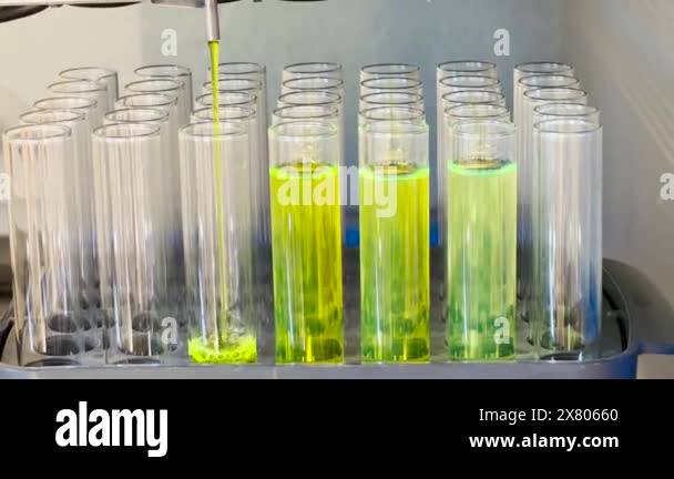 Green fluorescent compound is separated in automated machine. test tube ...