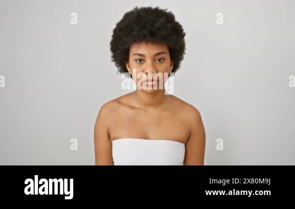 Joyous african american woman showcasing a toothsome smile with comb in ...