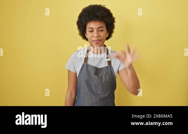 Joyful african american woman, sporting a happy grin and standing ...