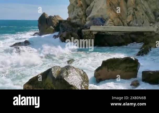Amazing rocks cliffs stones and boulders mountains and huge big surfer ...