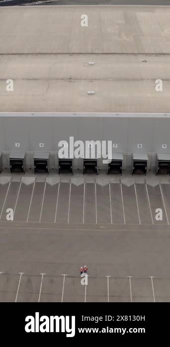 Engineers walk to check large storage terminal with loading docks for ...