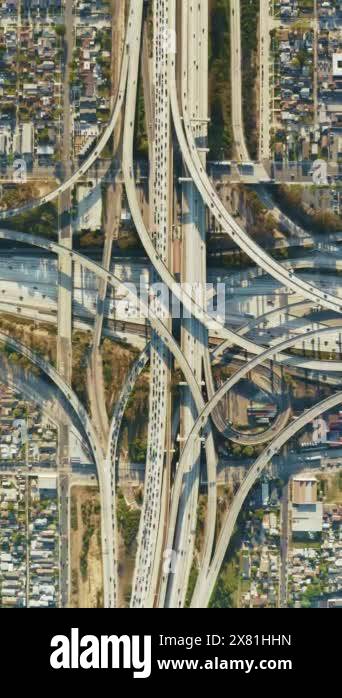 This vertical aerial view captures the dynamic traffic and complex ...