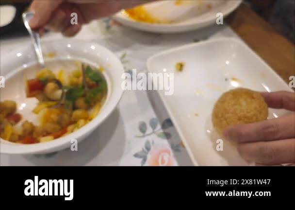 Panipuri is deep-fried breaded sphere filled with potato, onion, or ...