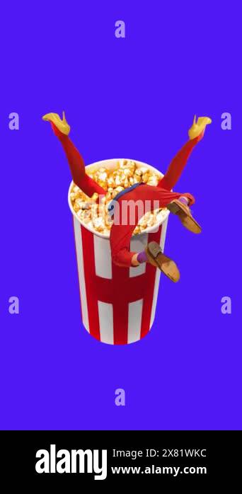 Male and female legs sticking out popcorn basket. Stop motion ...