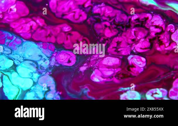 This stock video features added to liquid coloring, resulting to a ...