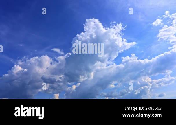 Blue sky white clouds. Puffy fluffy white clouds. Cumulus cloud cloudscape timelapse. Summer ...