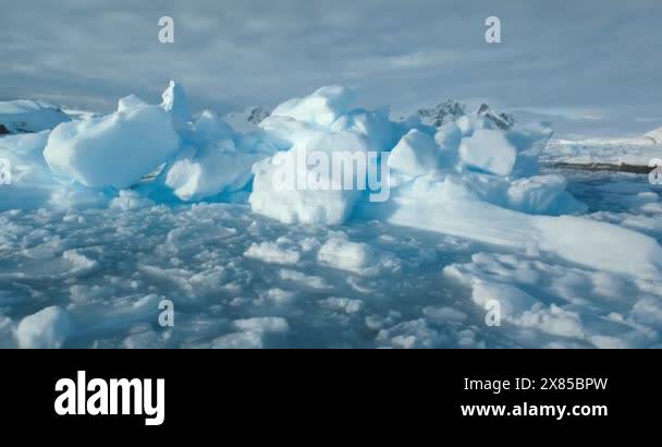 Snow covered ice bricks on frozen ocean surface in Antarctica ...